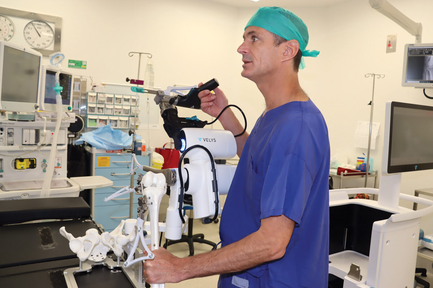 Associate-Professor-Chris-Jones-using-VELYS-Robot-at-SJGMH - Medical Forum